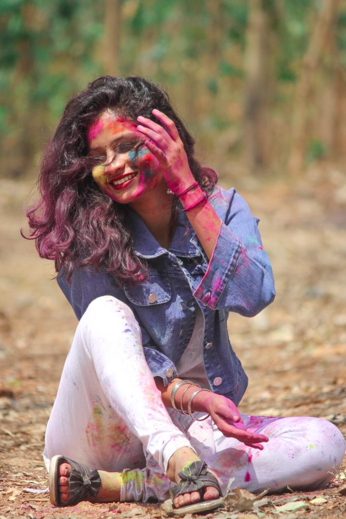 A girl playing with Holi colors - PixaHive