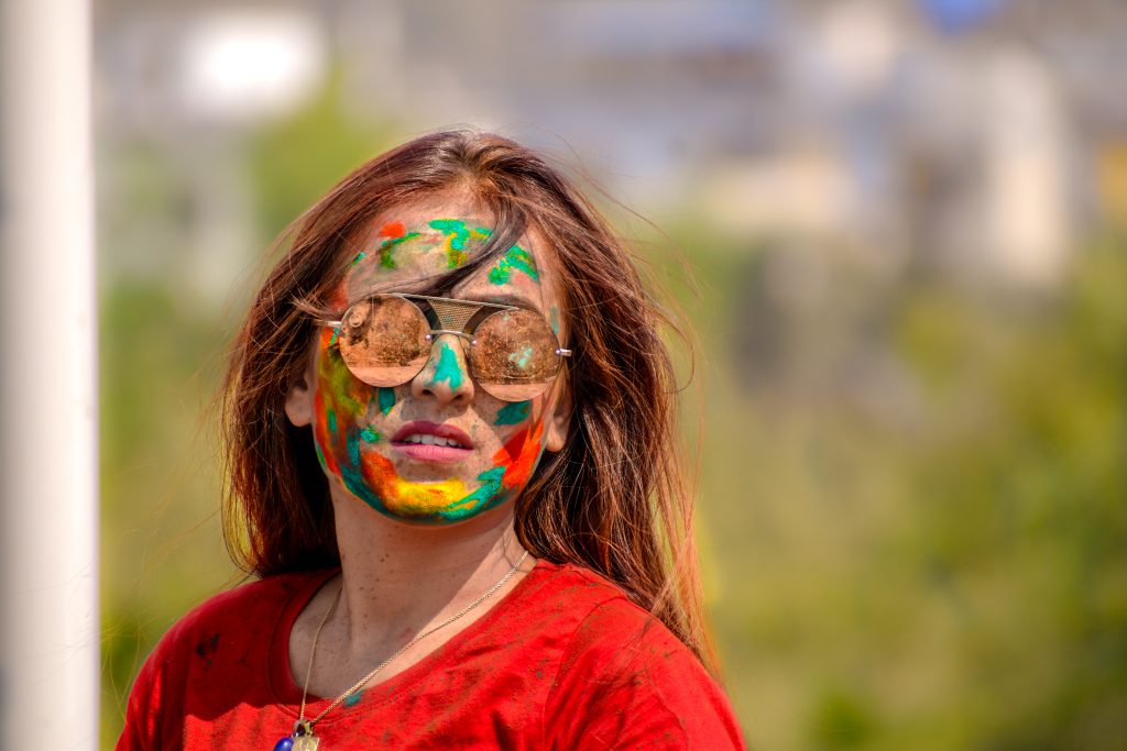 A girl's face painted with Holi colors - PixaHive