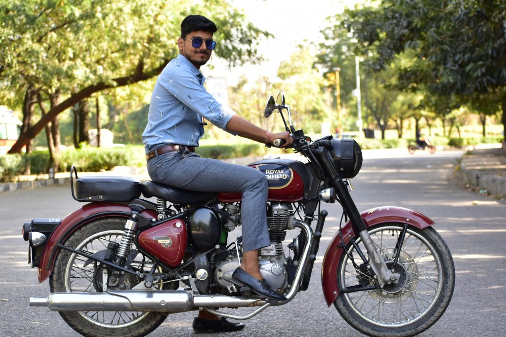 A man on a Royal Enfield bike - PixaHive