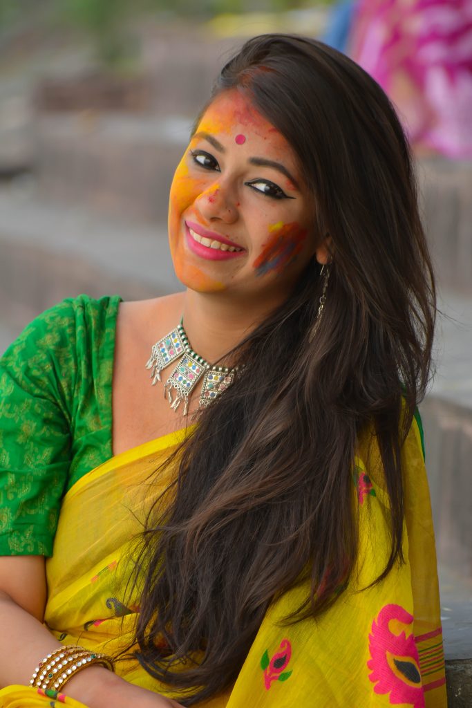 Beautiful girl playing with Holi colors - PixaHive