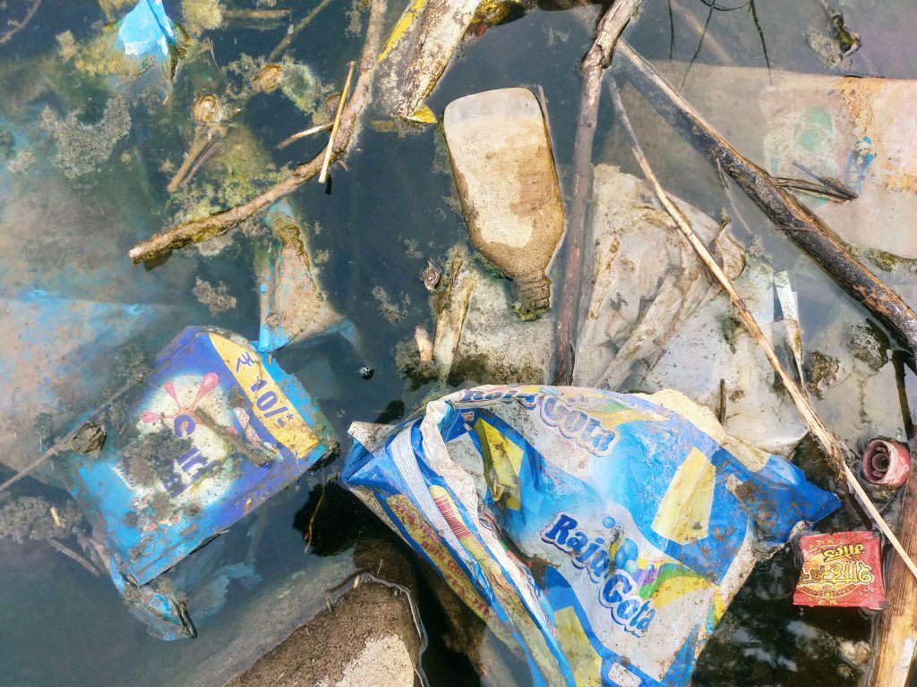 Garbage dumped in a water resource - PixaHive