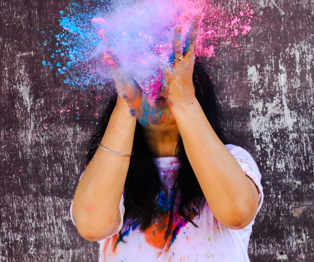 Girl playing with Holi colors - PixaHive
