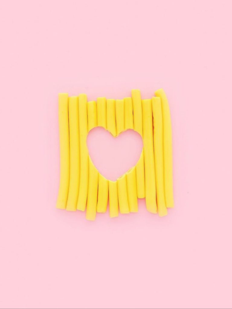 Heart shape made with yellow sticks - PixaHive