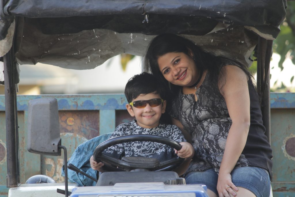 Happy mother and son on a tractor - PixaHive