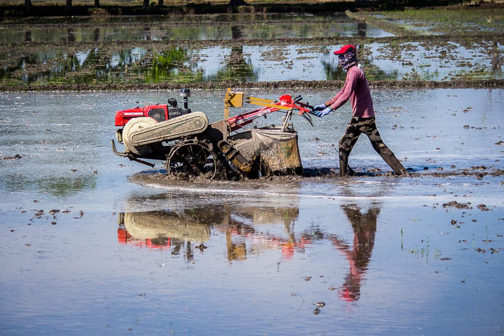 A farmer working with a machine - PixaHive