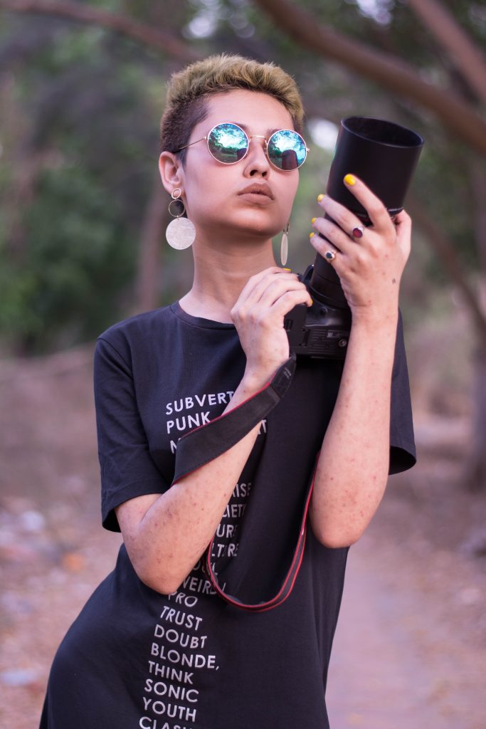 A stylish girl with a camera - PixaHive