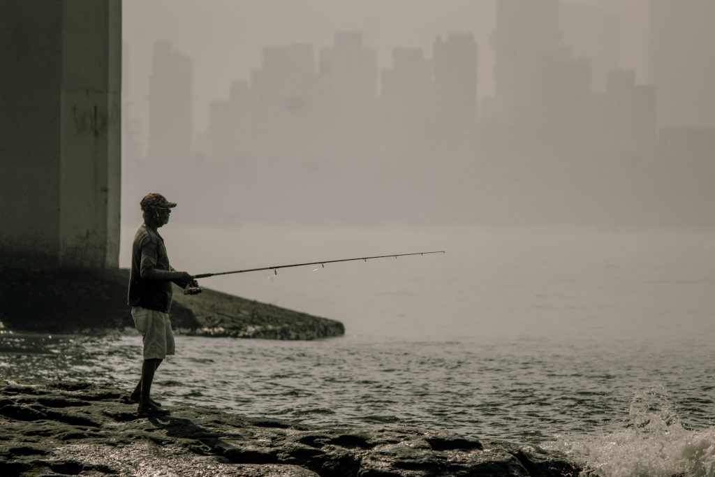 Man fishing in the Sea - PixaHive
