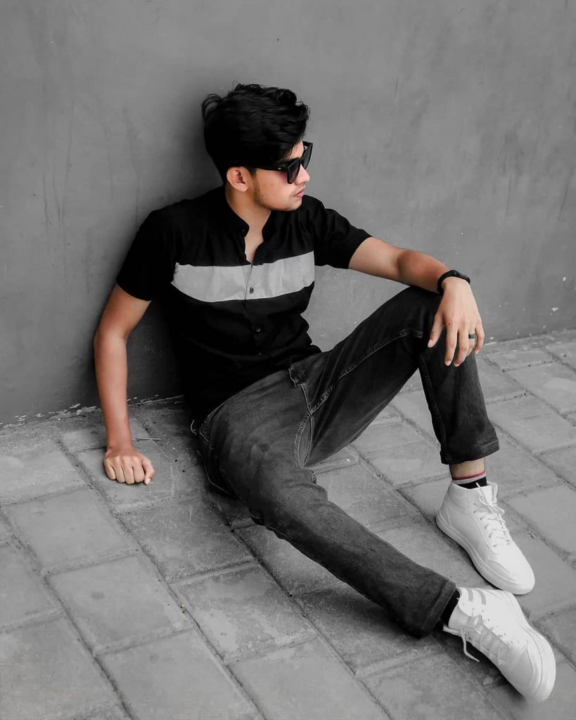 Model sitting and posing in Black outfit - PixaHive